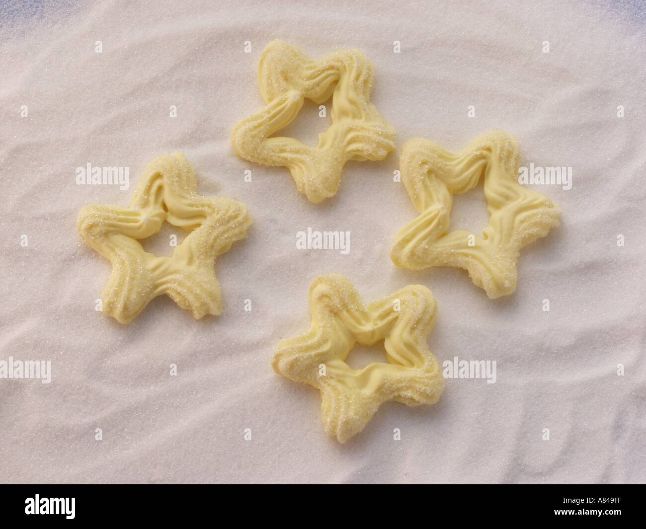 Yellow meringue stars Stock Photo - Alamy