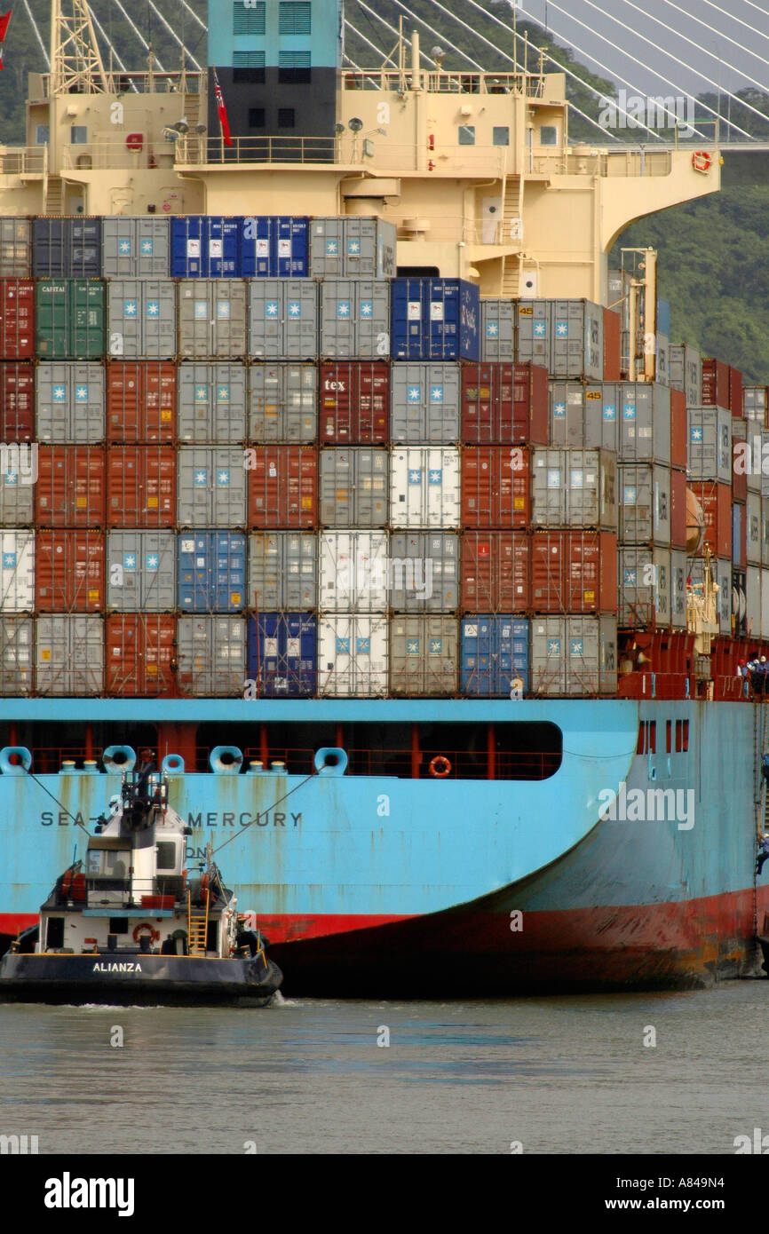 Tugboat positioning container ship in the Panama Canal, Panama Stock ...