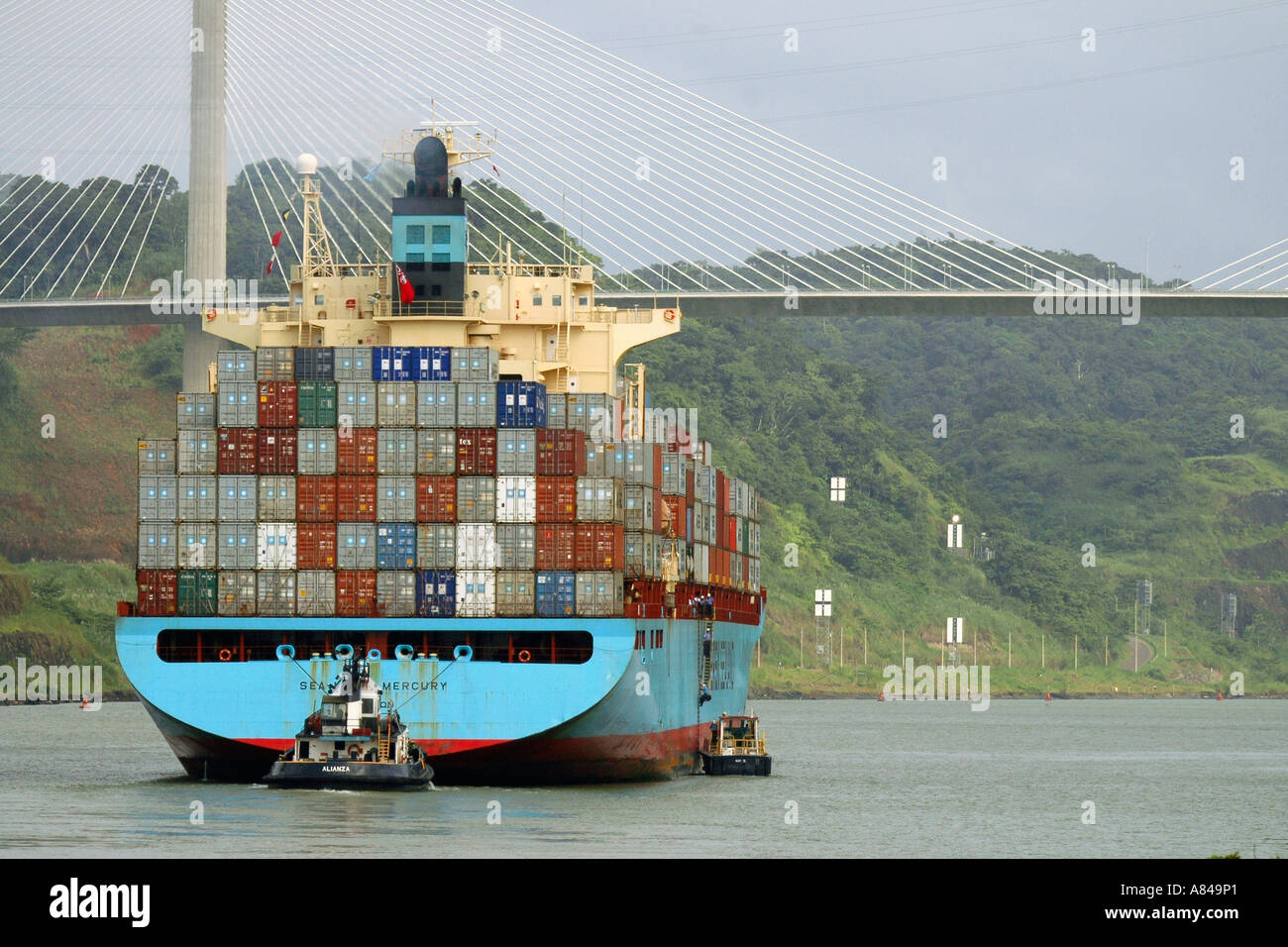 Tugboat positioning container ship in the Panama Canal, Panama Stock ...
