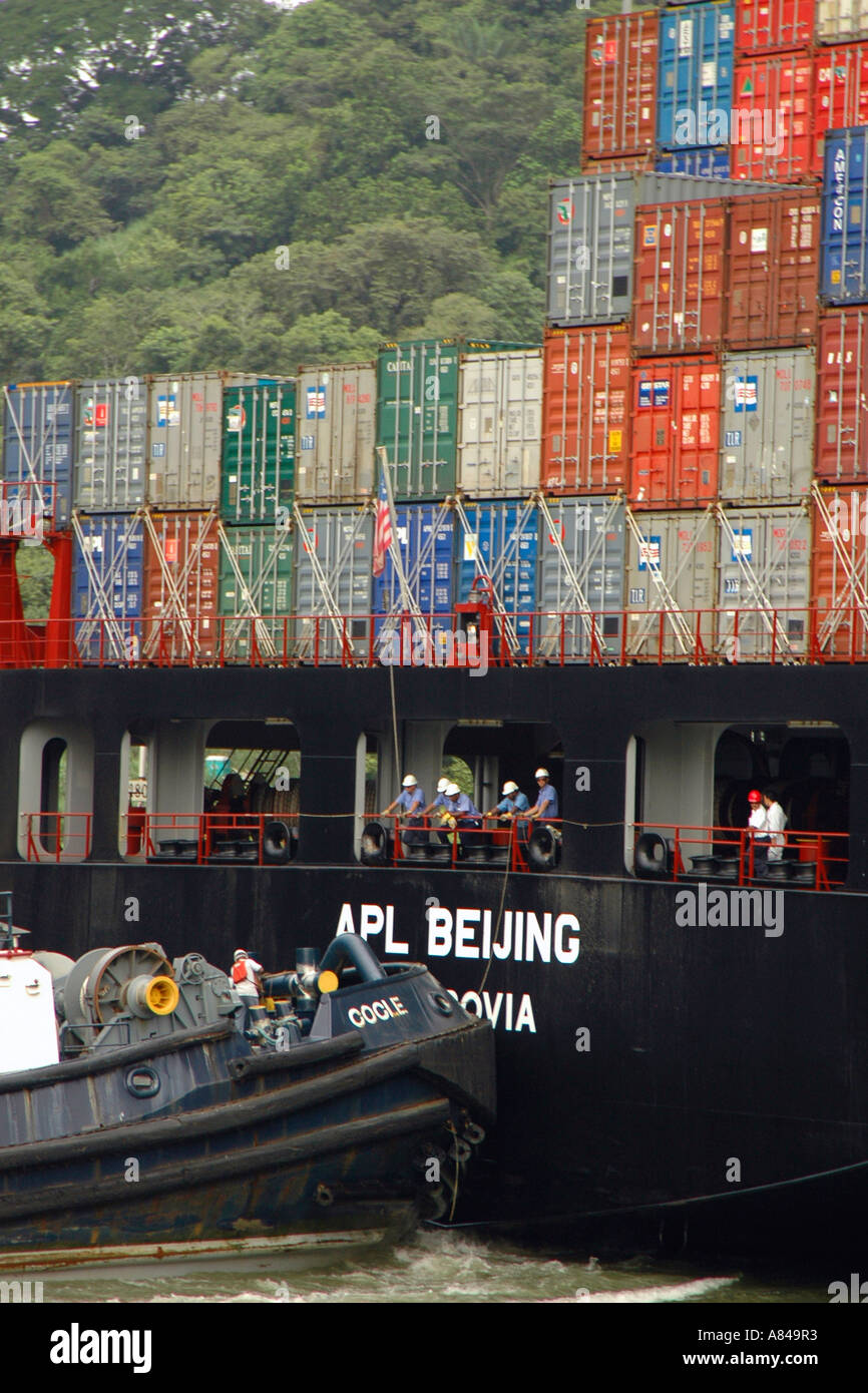 Tugboat positioning container ship in the Panama Canal, Panama Stock ...