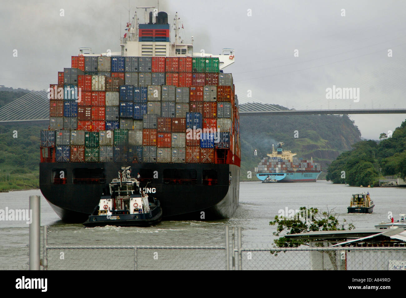 Tugboat positioning container ship in the Panama Canal, Panama Stock ...