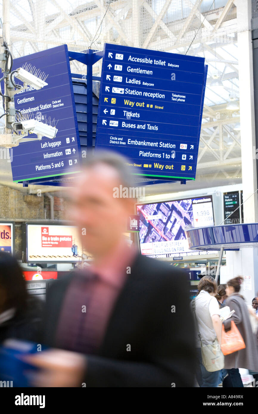 Commuters rushing through a station concourse on their way to work ...
