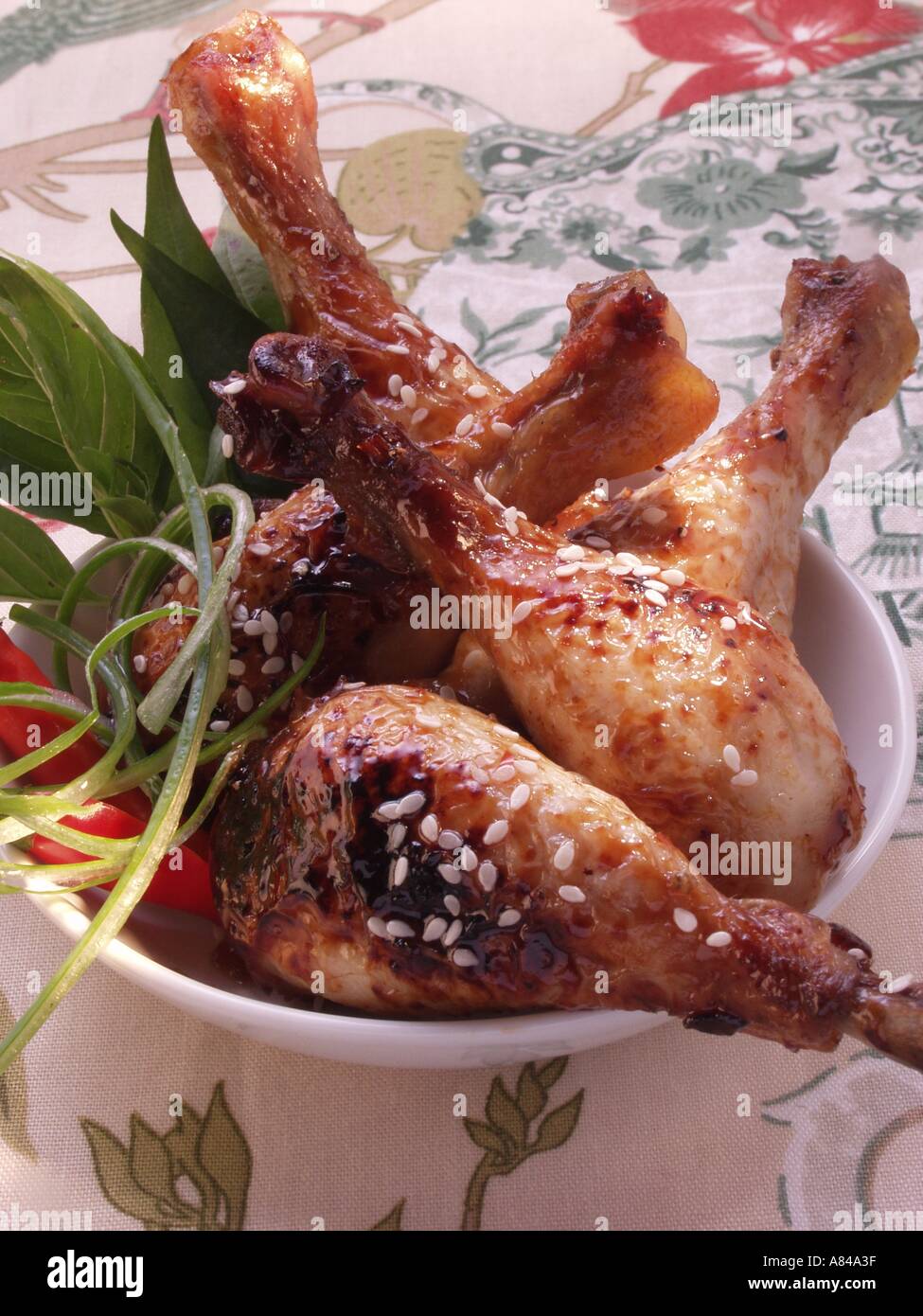 Asian chicken legs with sesame 2 Stock Photo - Alamy