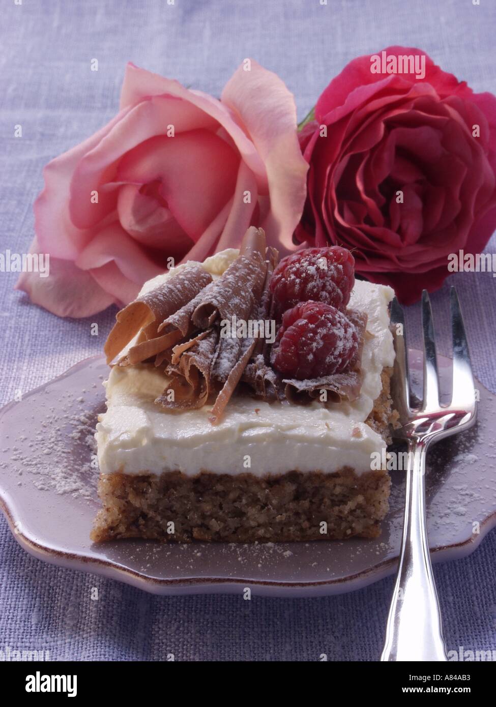 Nut cake with mascarpone chocolate curls raspberries 2 Stock Photo - Alamy