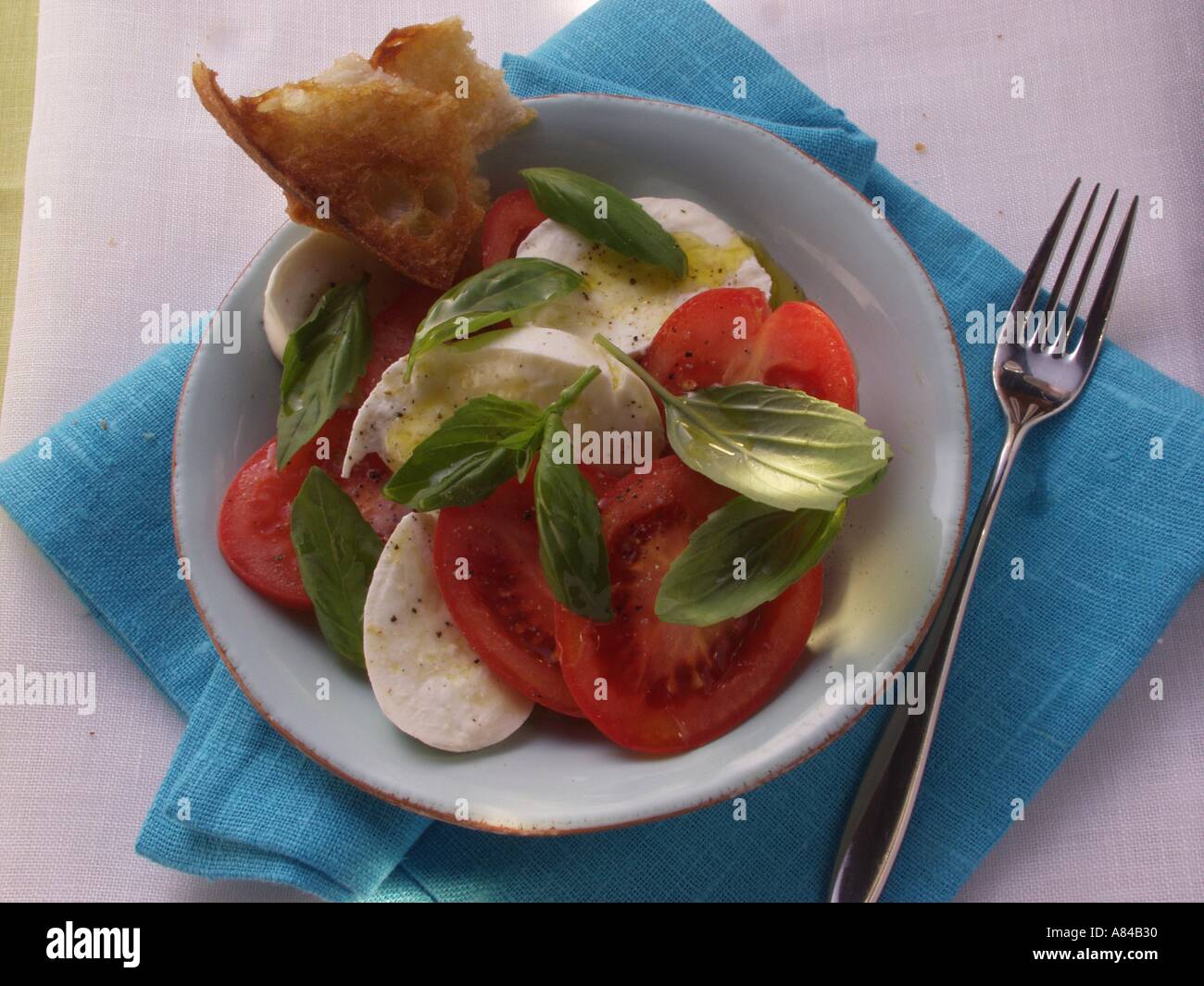Tomatoes with mozzarella and basil white bread 2 Stock Photo - Alamy