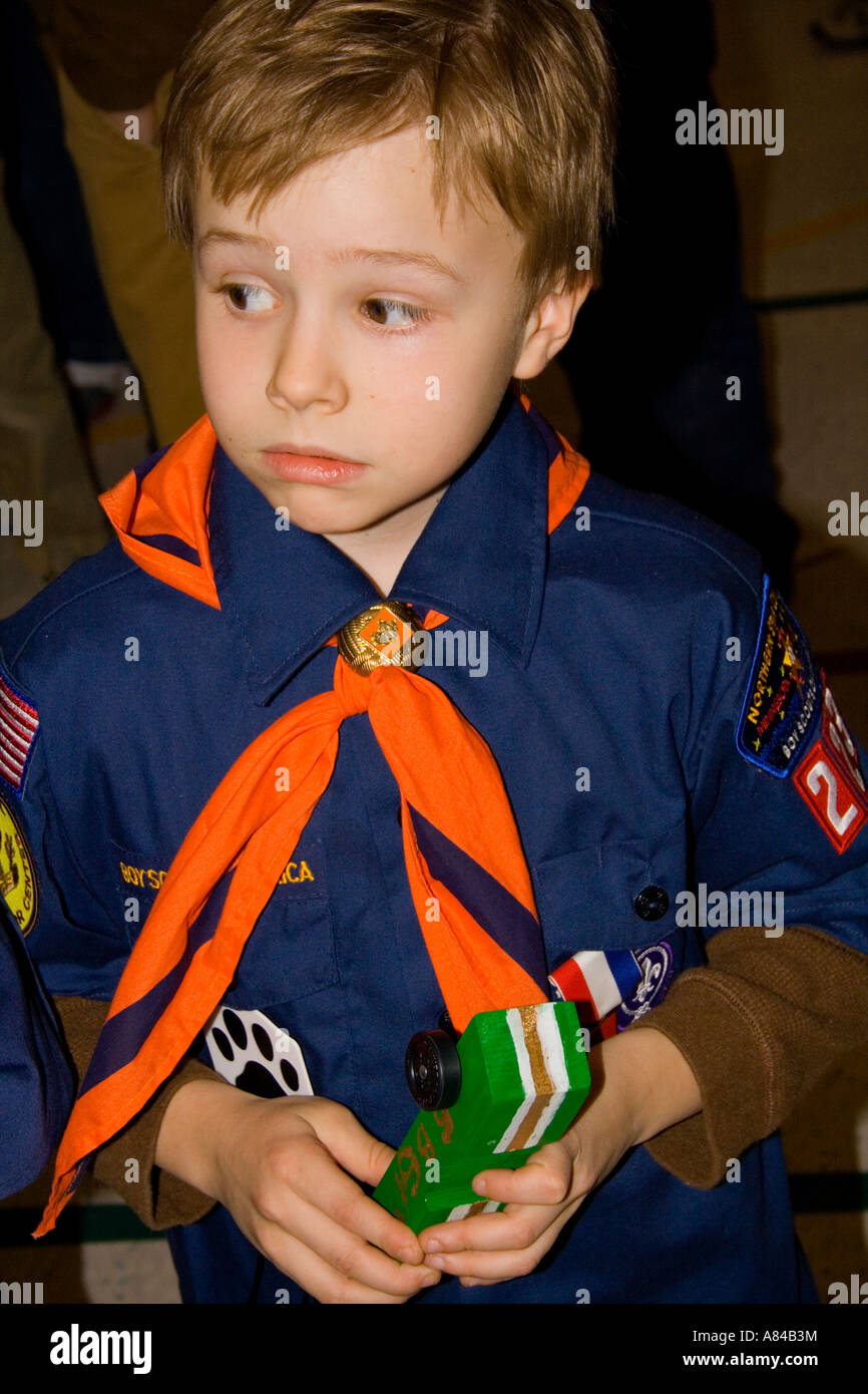 Cub Scout age 7 holding race car in annual Pinewood Derby. Horace Mann ...
