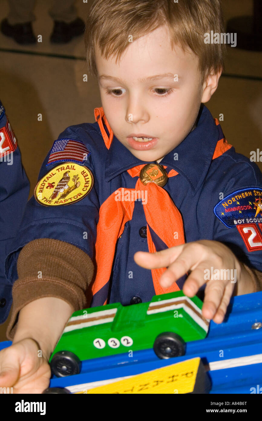 Cub Scout age 7 starting race cars in the Pinewood Derby. Horace Mann ...