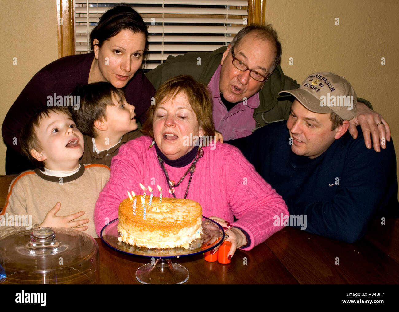 Three generation family singing happy birthday to grandma age 66. "St ...