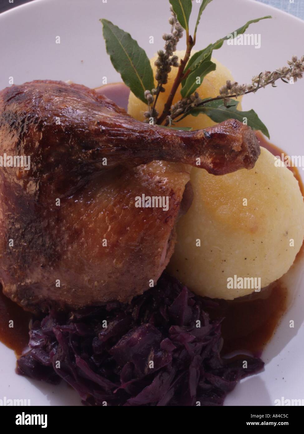 Duck with red cabbage potato dumpling bay leaf mugwort 4 Stock Photo ...