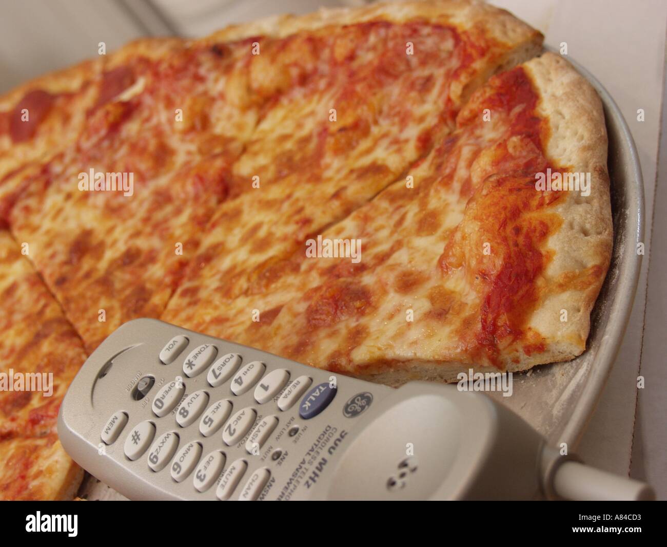 Call a pizza Pizza margherita with telephone 2 Stock Photo - Alamy