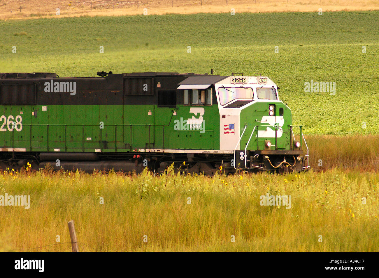 BNSF Locomotive rolling through fields in western Nebraska Stock Photo ...