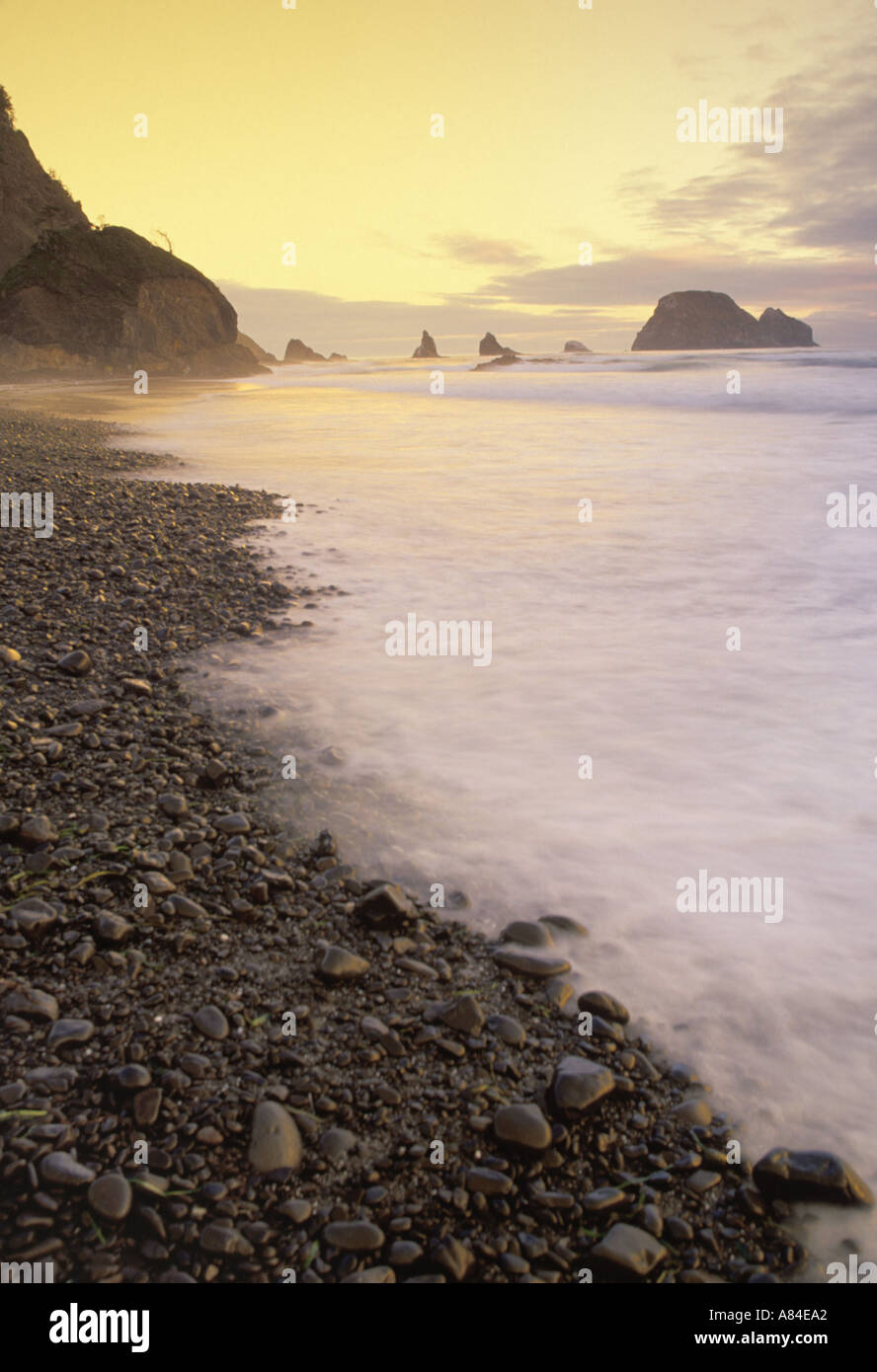 Surf over beach pebbles Oceanside Oregon Stock Photo - Alamy