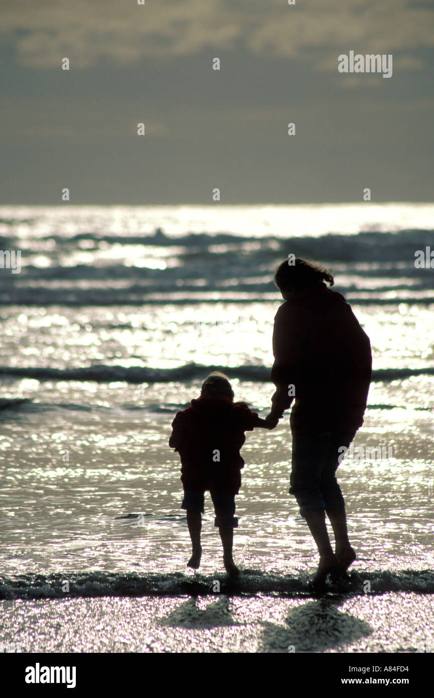Girl playing in ocean surf hi-res stock photography and images - Alamy