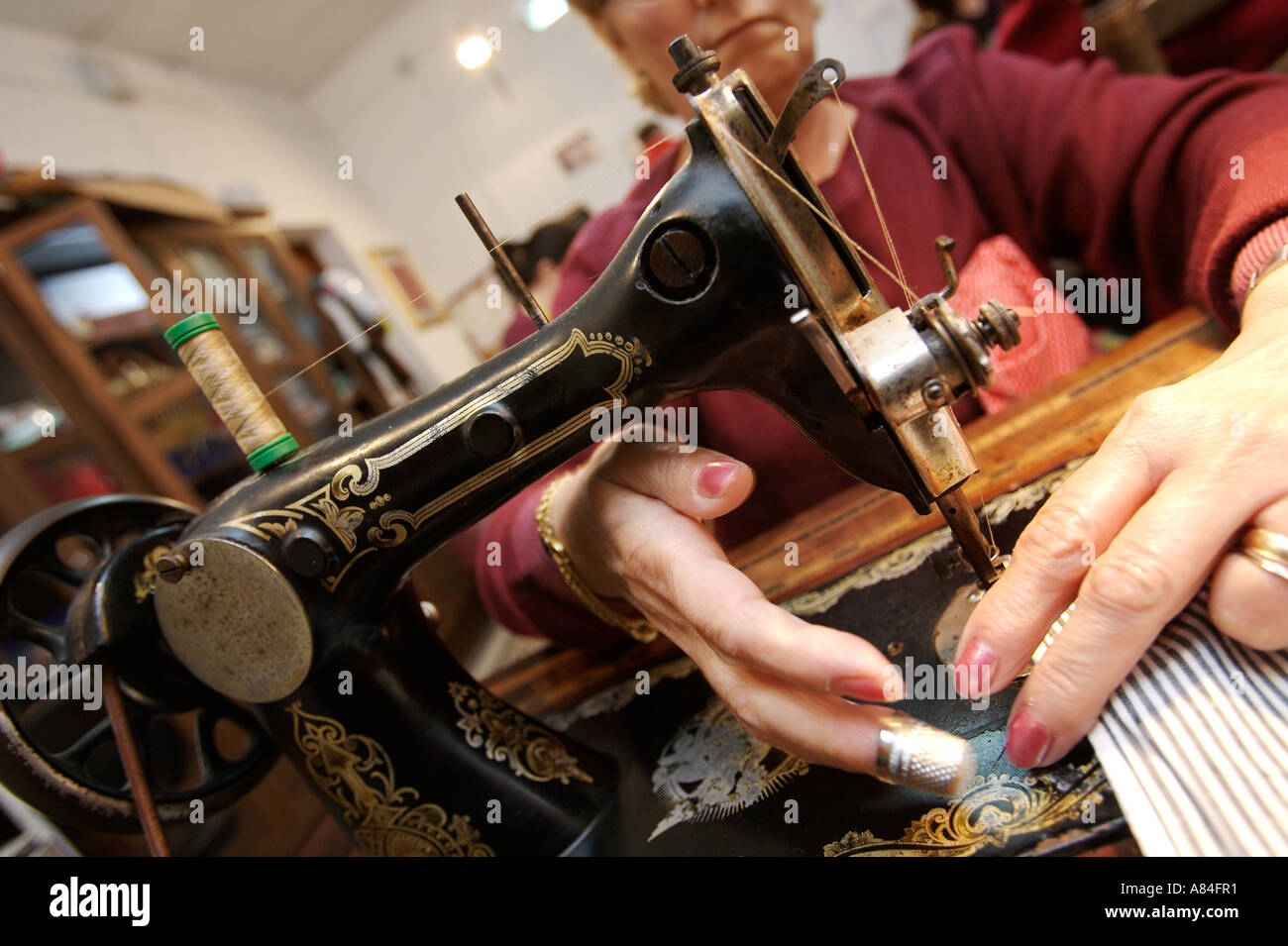 Seamstress working on traditional sewing machine Stock Photo - Alamy