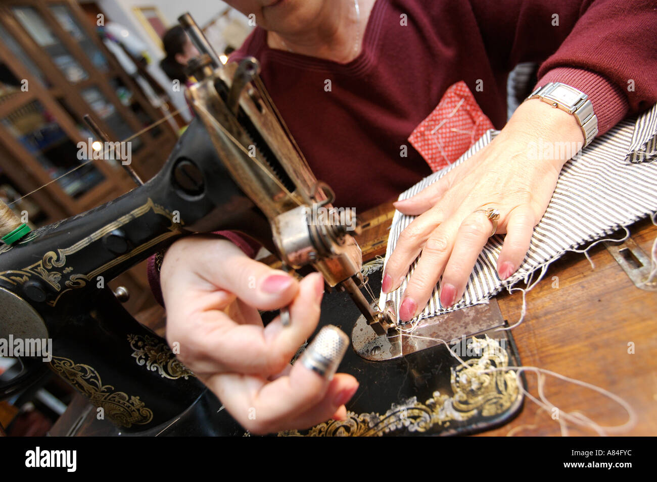 Seamstress working on traditional sewing machine Stock Photo - Alamy