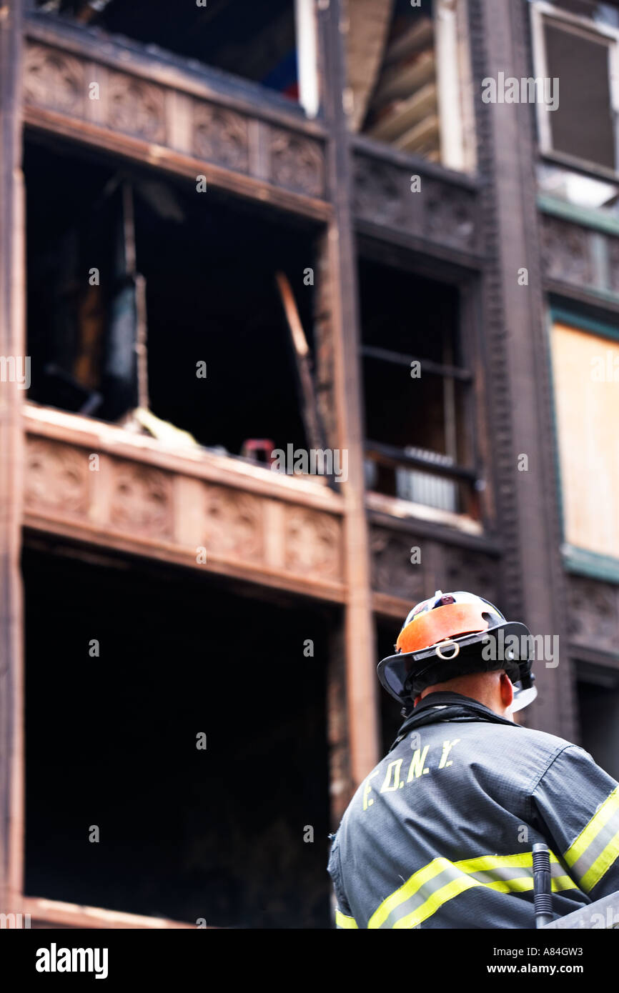 Fireman with hose new york hi-res stock photography and images - Alamy
