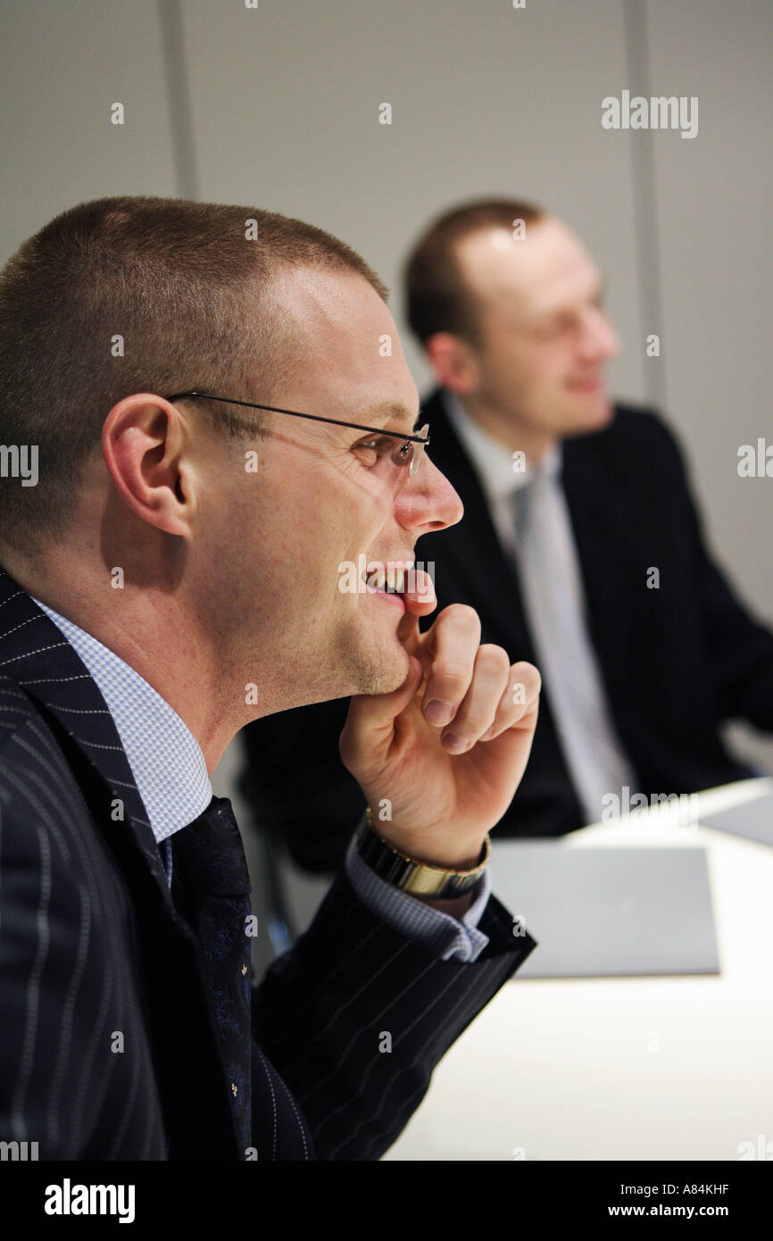Businessman posing for a commercial photoshoot in office boardroom ...