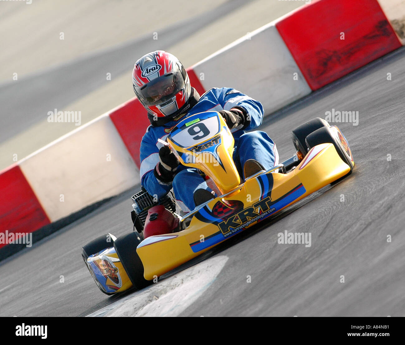 A kart racer negotiates an extreme high-speed turn Stock Photo - Alamy
