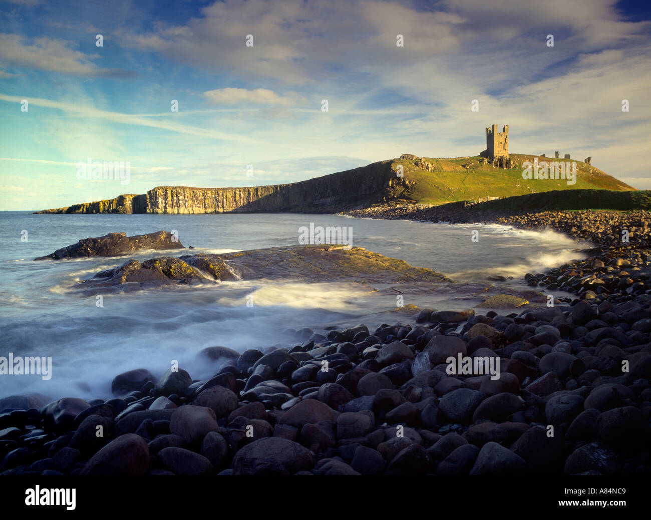 The romantic ruins of Dunstanburgh Castle in Northumberland England UK ...
