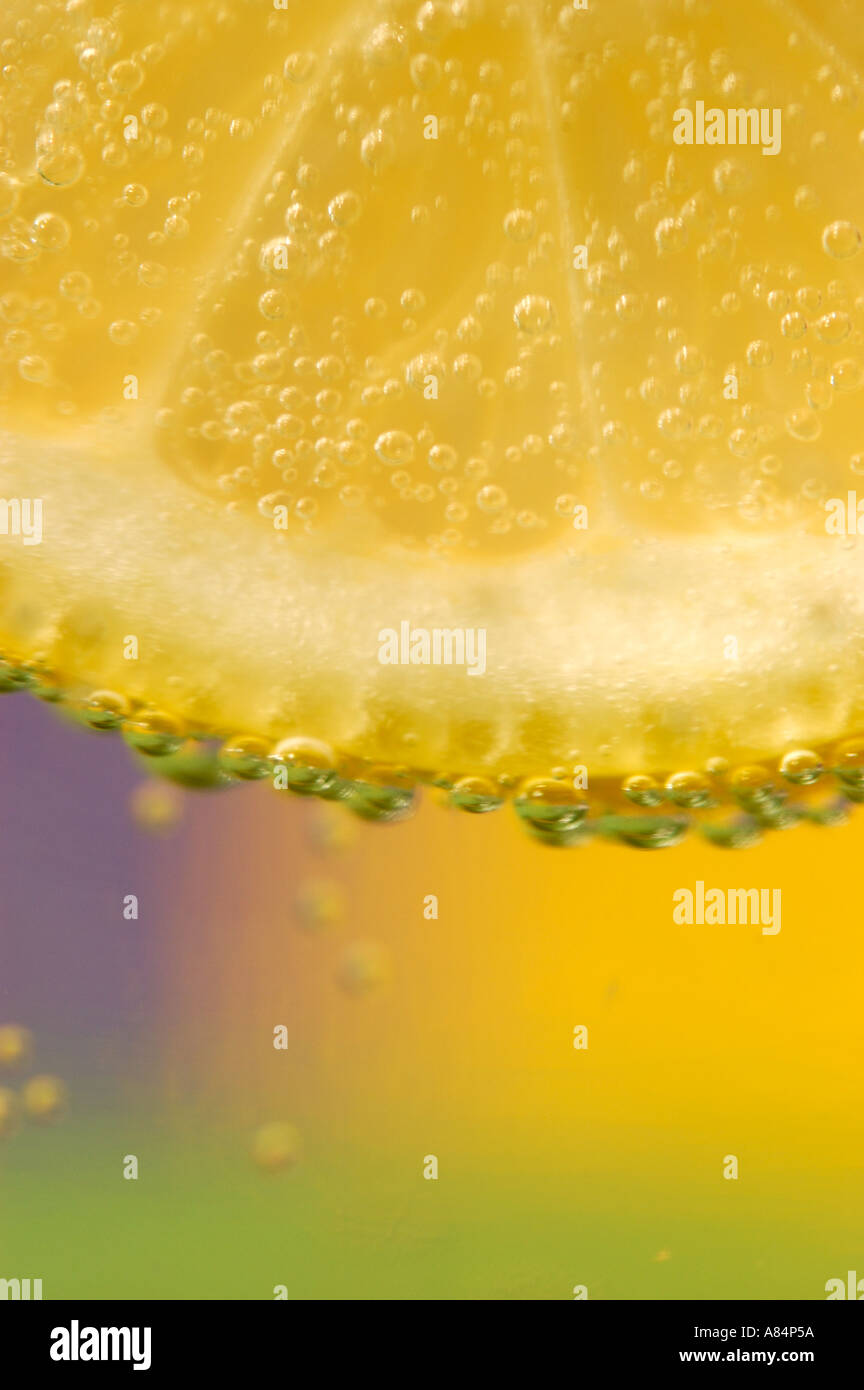 A lemon slice placed in carbonated drink is surrounded by bubbles Stock ...