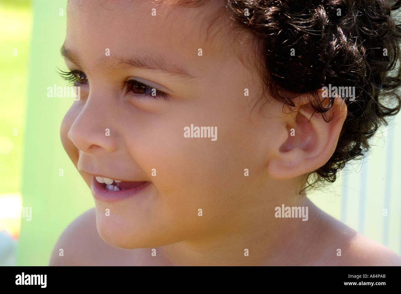 A young boy smiles as he enjoys the outdoors Stock Photo - Alamy