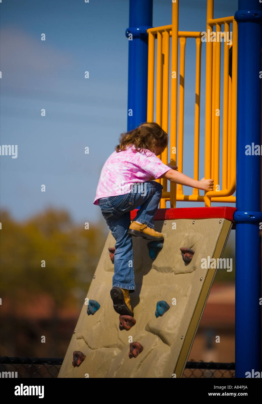 Child climbing in a playground Stock Photo - Alamy