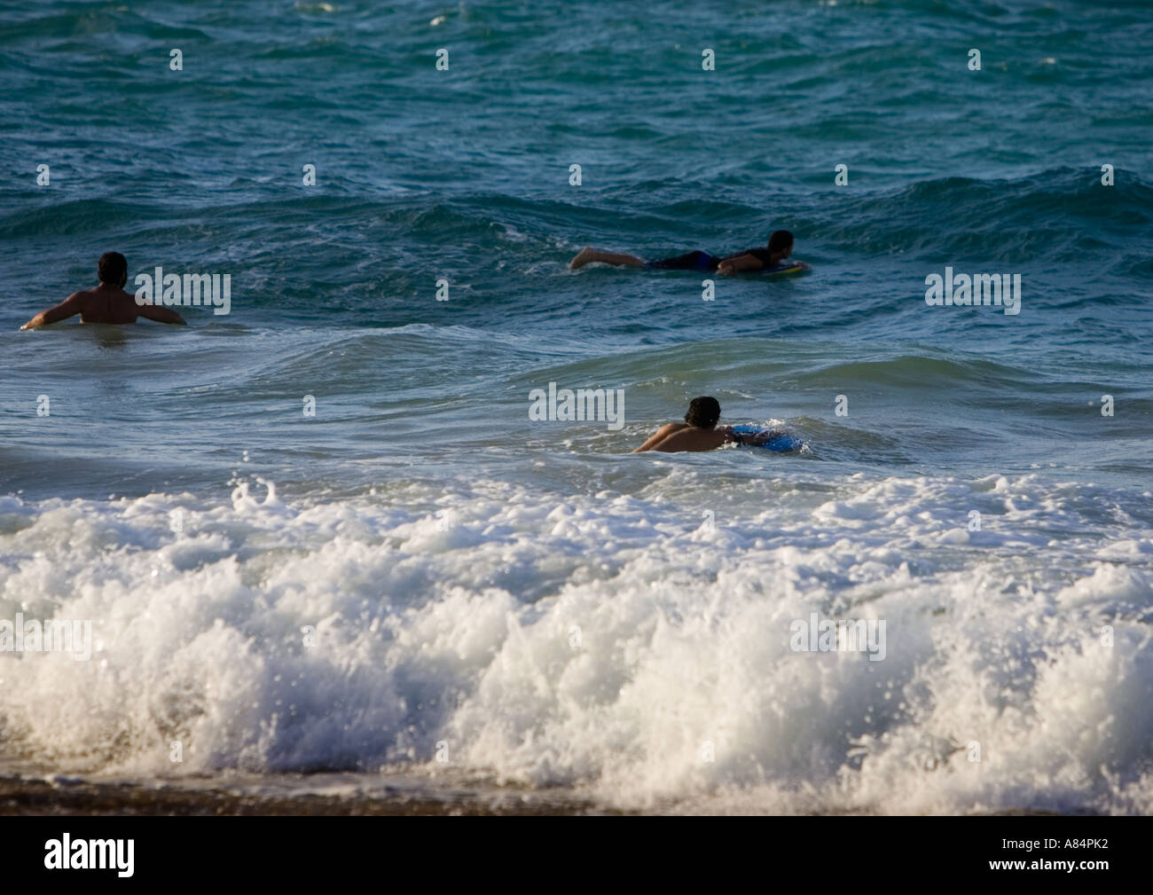 Boys playing in the surf hi-res stock photography and images - Alamy