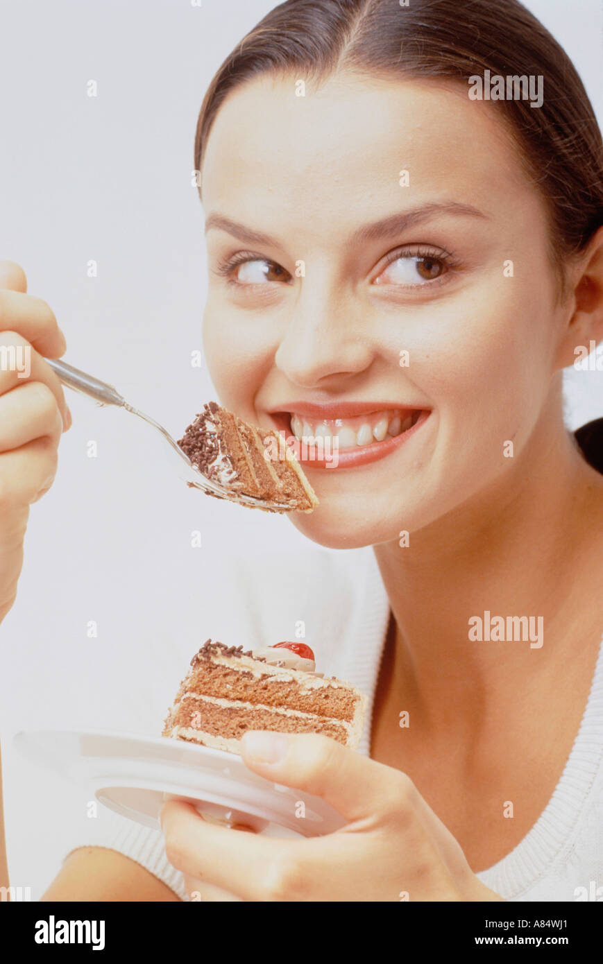 Woman eating cake and guilty hi-res stock photography and images - Alamy