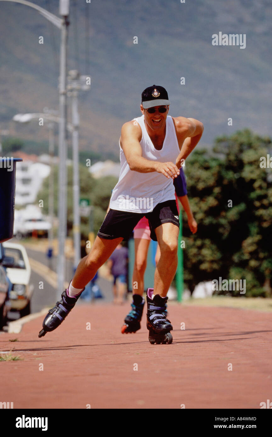 Woman rollerblades rollerblading hi-res stock photography and images ...