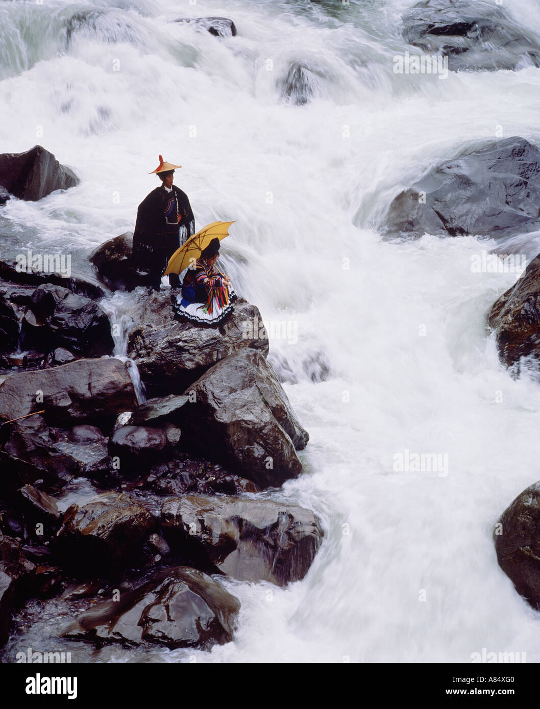 China. Sichuan Province. Couple in traditional clothes by Pearl Shoal ...