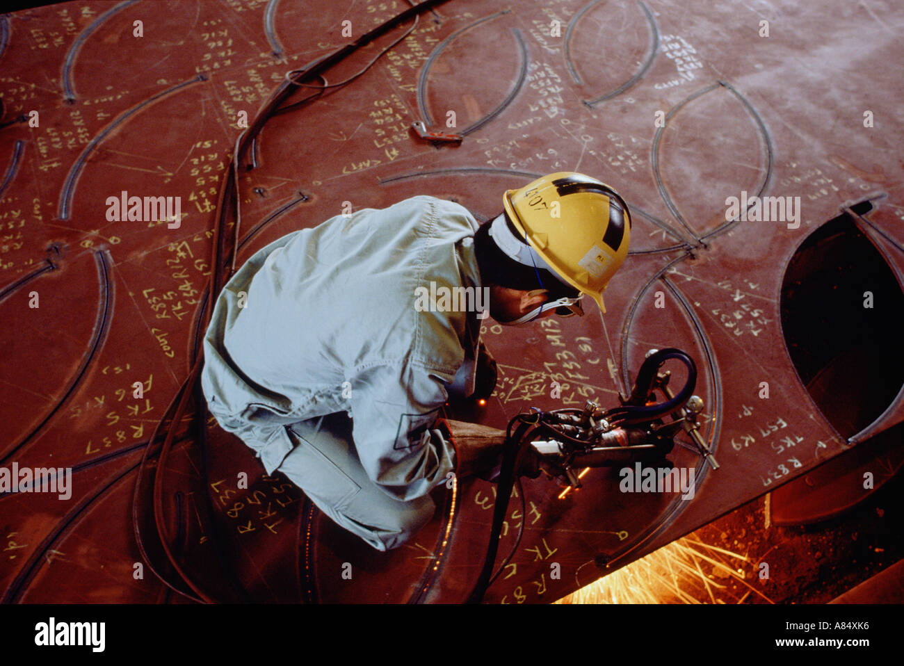 Singapore. Ship building industry. Overhead view of a man working ...
