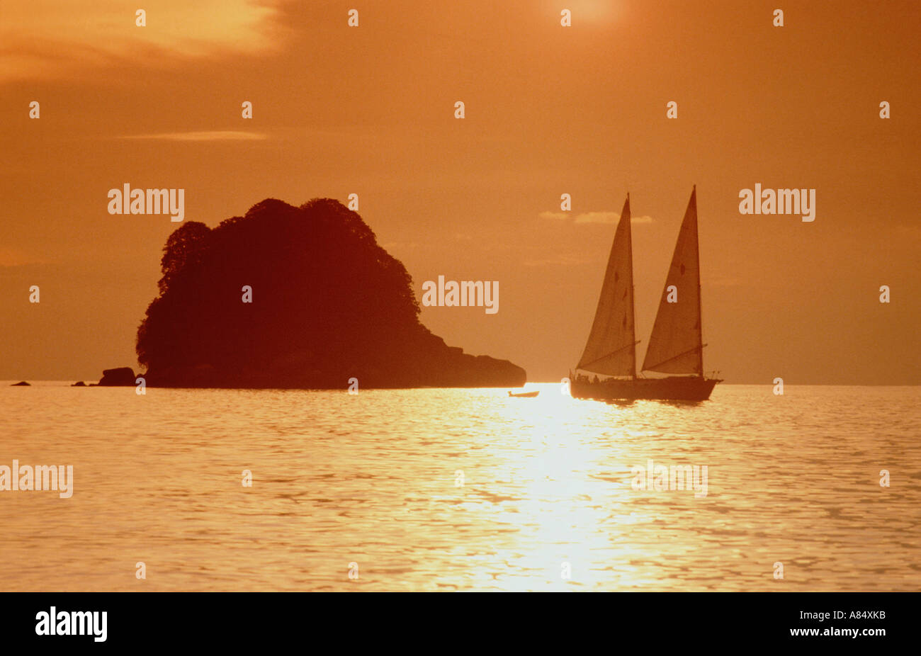 Malaysia. Tioman. Sea coast horizon with sail boat Stock Photo - Alamy