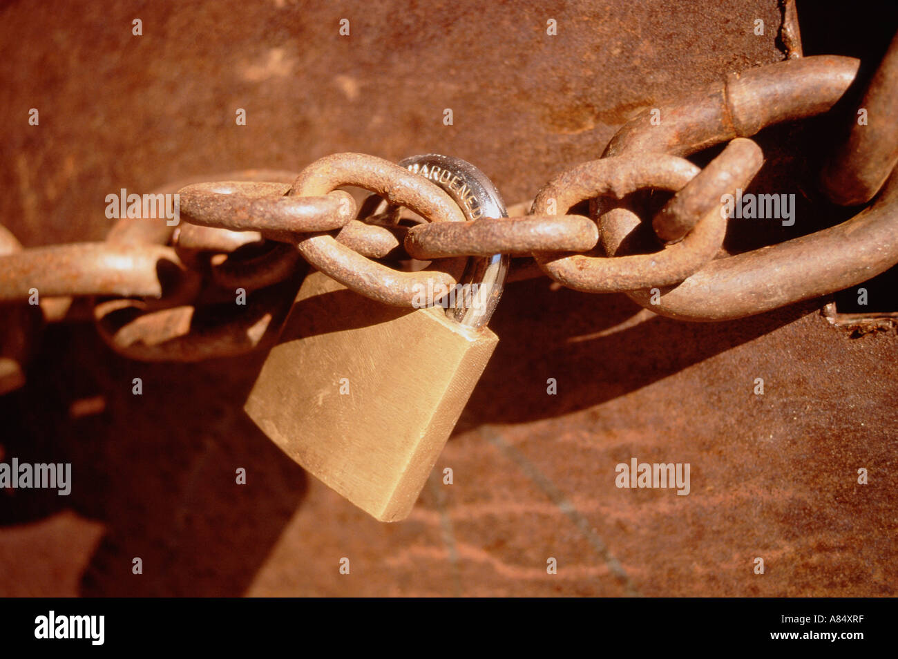 Closeup of padlock and chain Stock Photo - Alamy