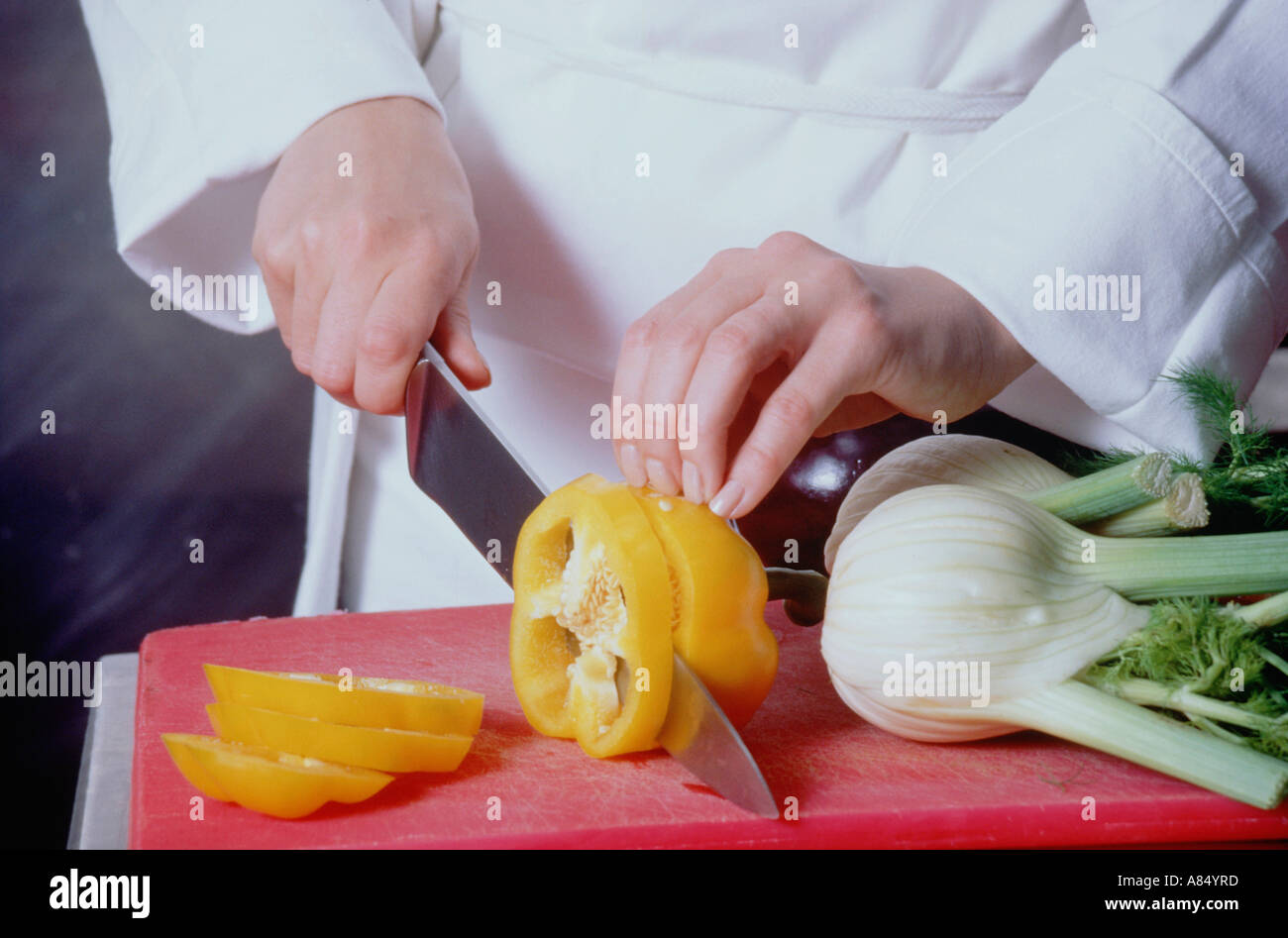 Hotel kitchen. Female chef. Food preparation. Close-up of chopping ...