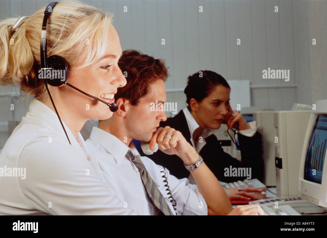 Call centre workers smiling hi-res stock photography and images - Alamy