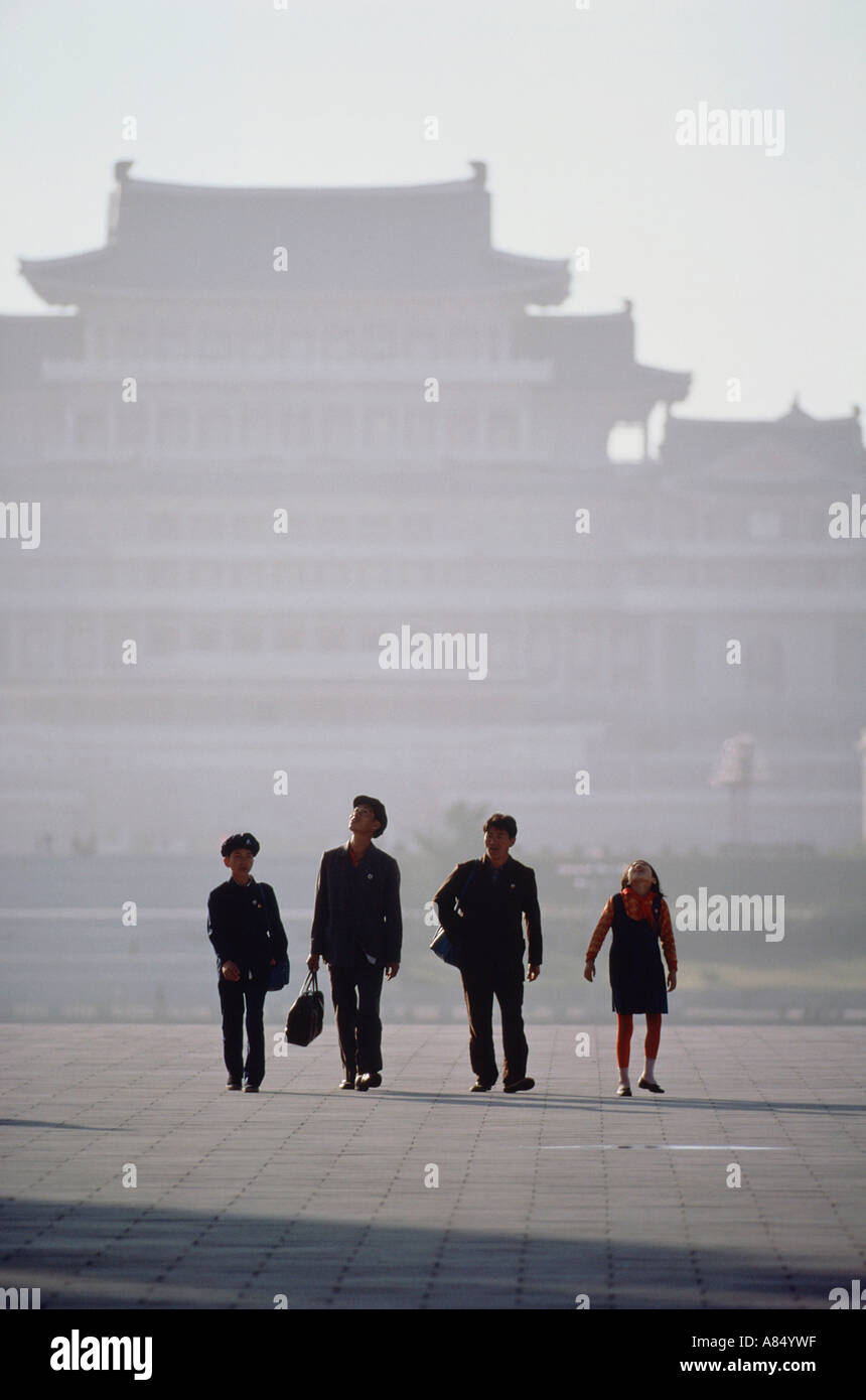 North Korea. Pyongyang. Kim Il Sung Square. Two men with children Stock ...