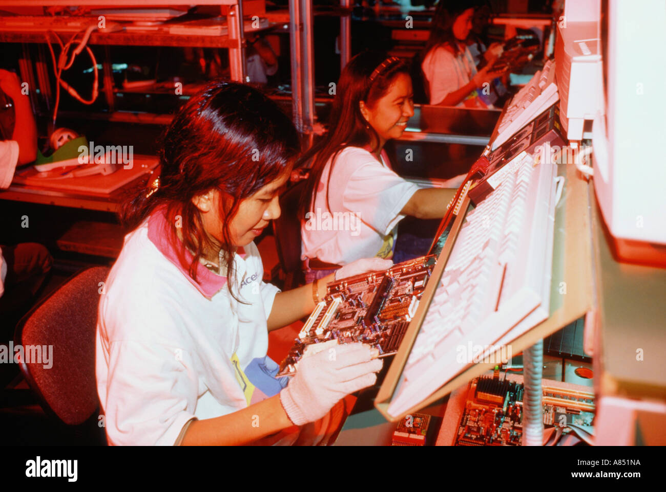 Philippines industry. Women in factory assembling computer mother ...