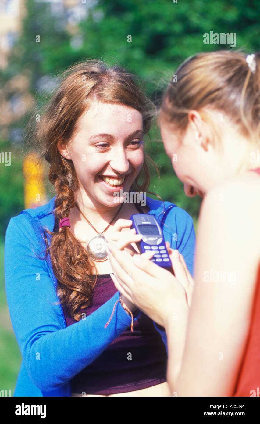 Teens with cell phones MODEL RELEASED Stock Photo - Alamy
