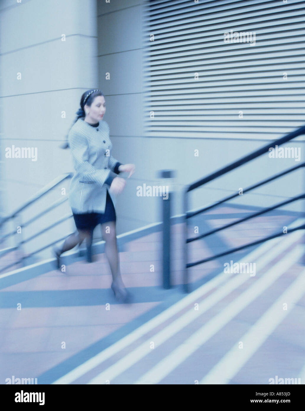 Woman running up urban steps hi-res stock photography and images - Alamy