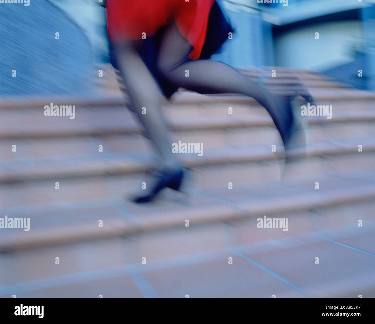 Close-up of woman's legs running up steps Stock Photo - Alamy