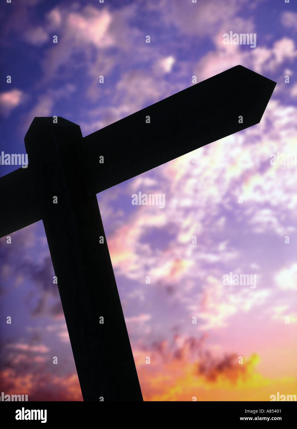 signpost in silhouette in dawn sky Stock Photo - Alamy