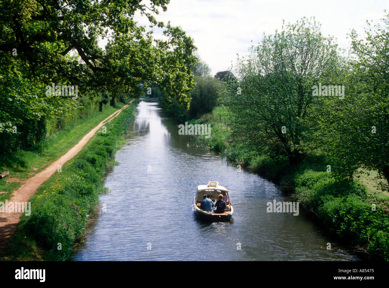 An electric powered dayboat on the Grand Western Canal near Tiverton in ...