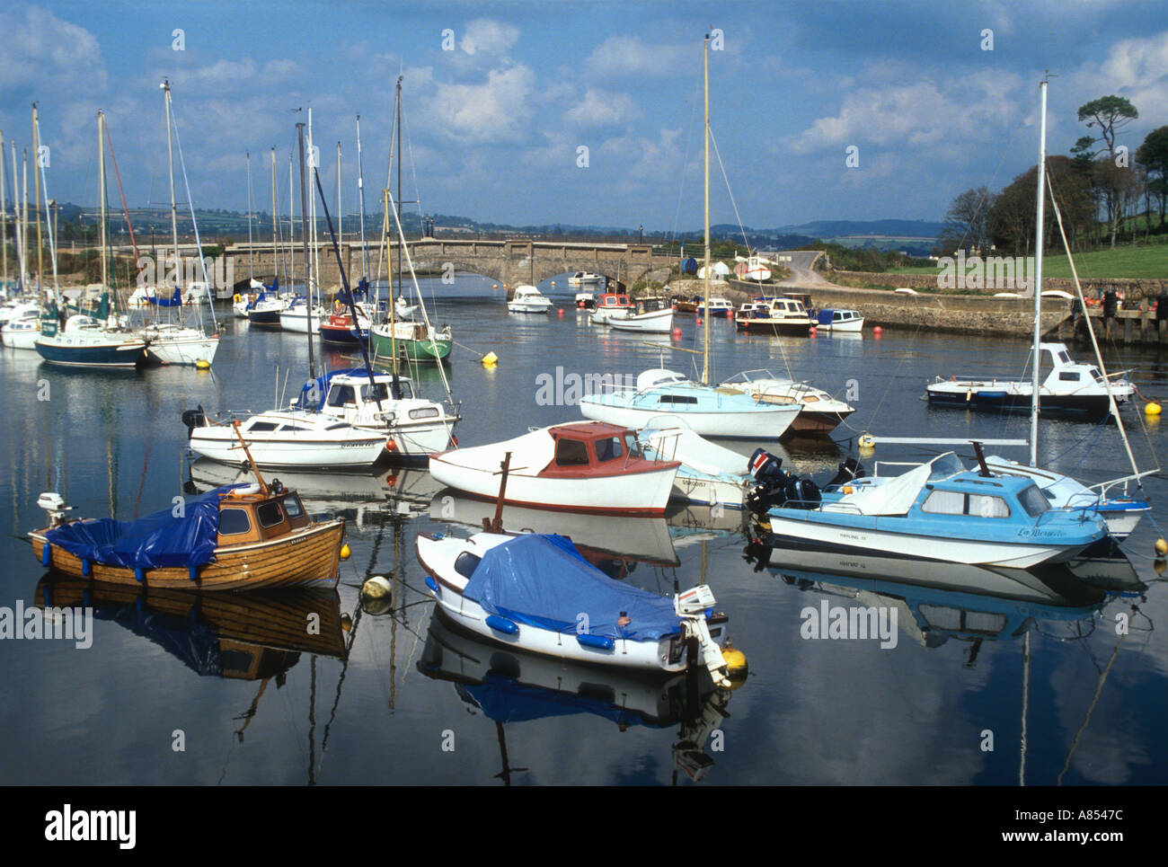 The harbour and Britain s oldest concrete bridge on the River Axe at ...