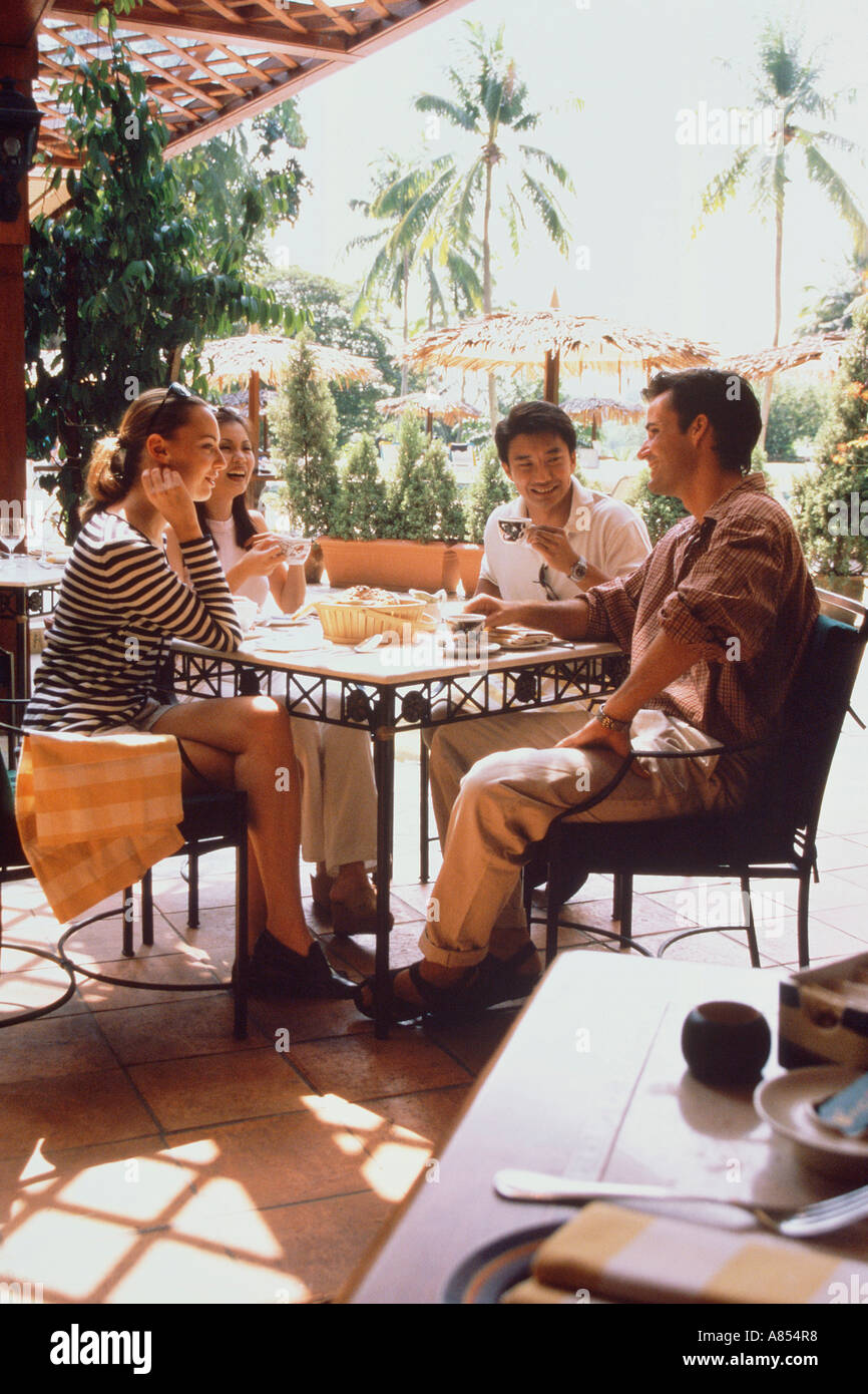 Group friends talking cafe terrace hi-res stock photography and images ...