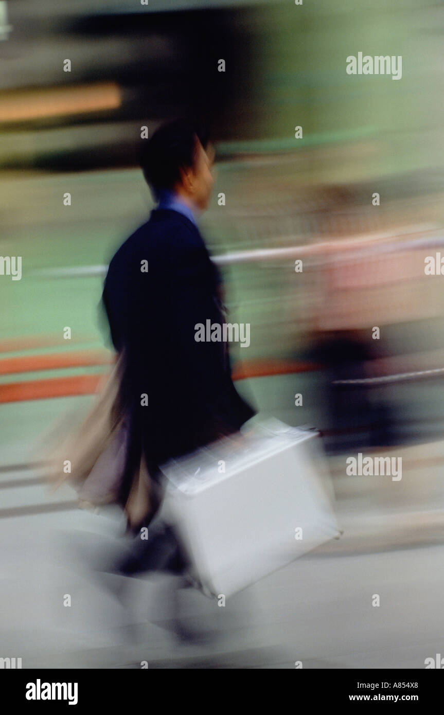 Man inside airport terminal hurrying to catch a plane Stock Photo - Alamy