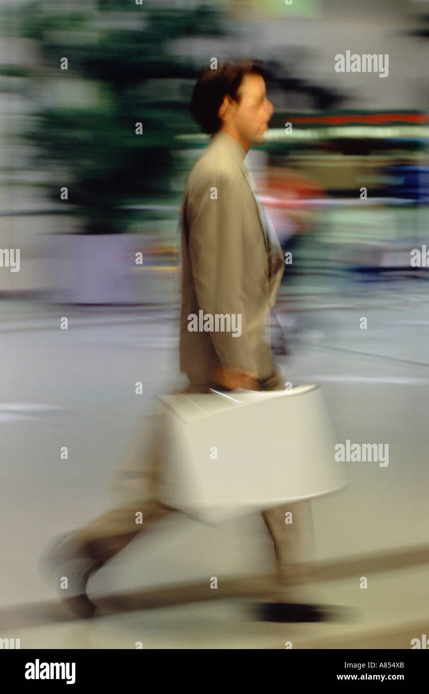 Man inside airport terminal hurrying to catch a plane Stock Photo - Alamy