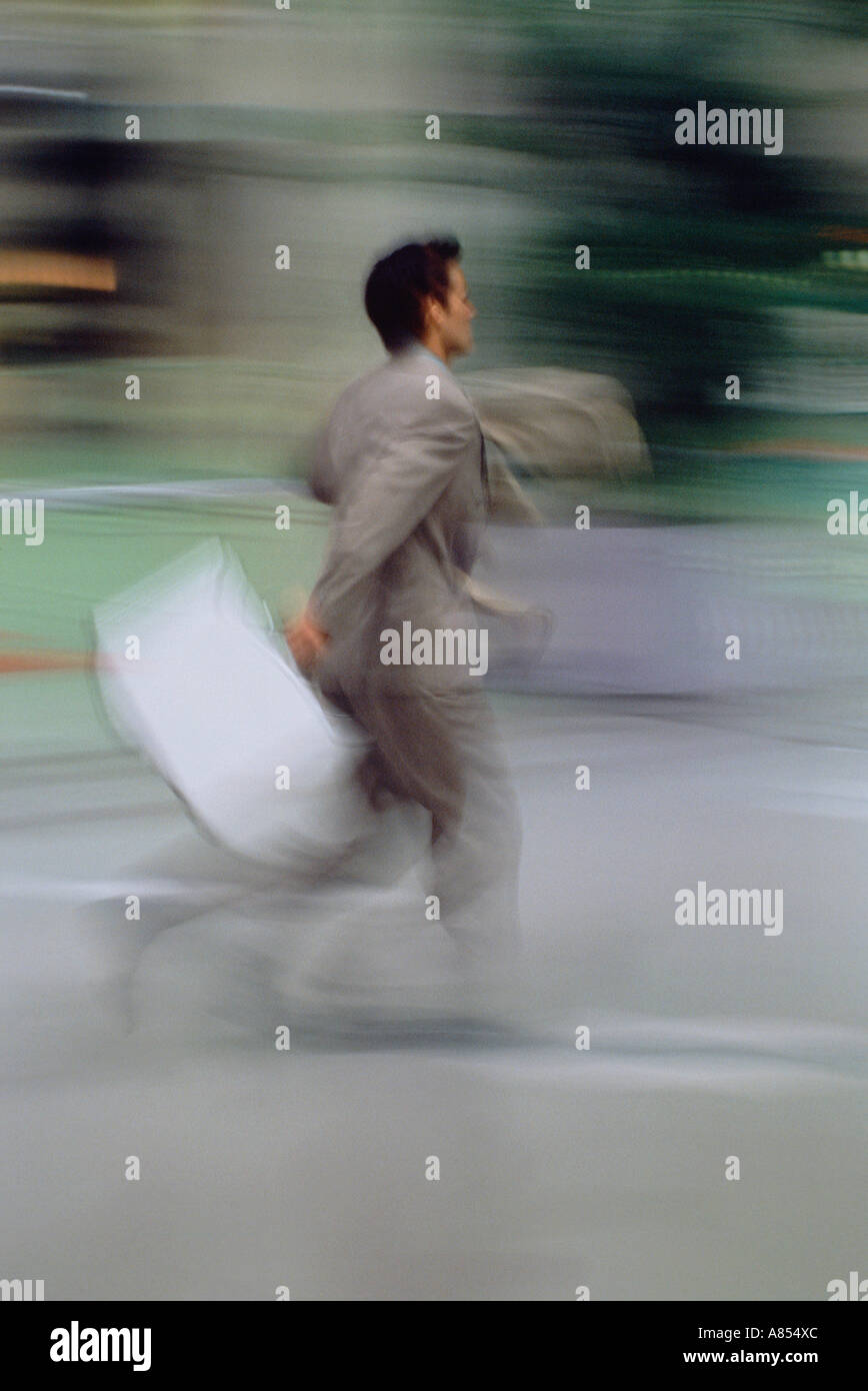 Man inside airport terminal hurrying to catch a plane Stock Photo - Alamy