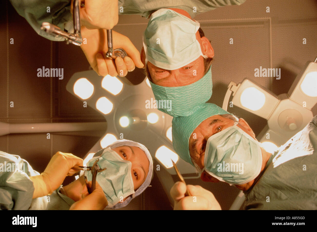 Indoor close-up of operating theater surgical team from patient's ...