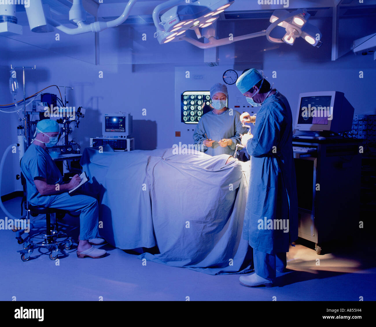 Neuro surgery. Surgeon, nurse and anesthetist with patient in hospital ...