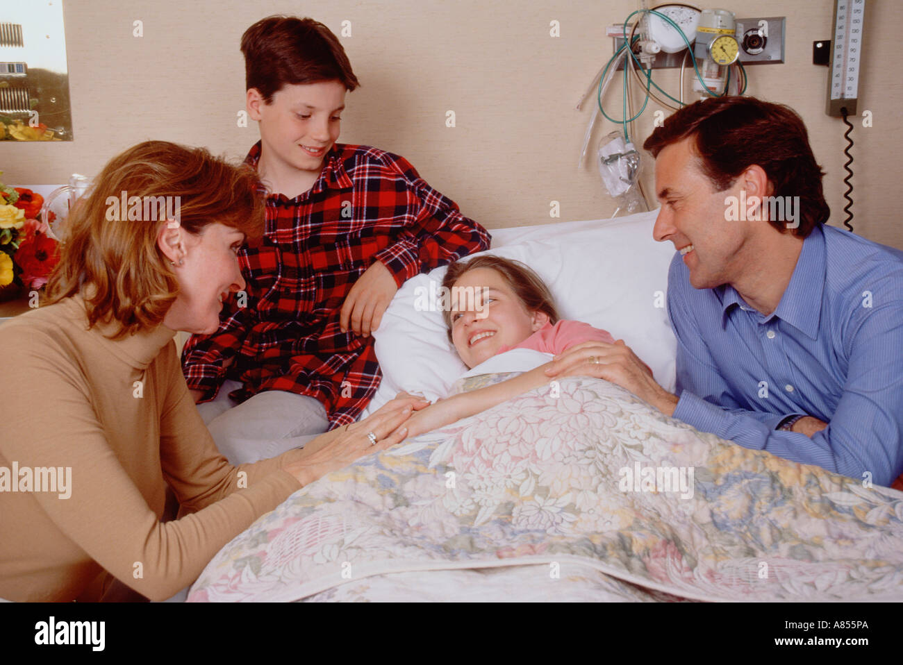 Family in hospital visiting child daughter Stock Photo - Alamy